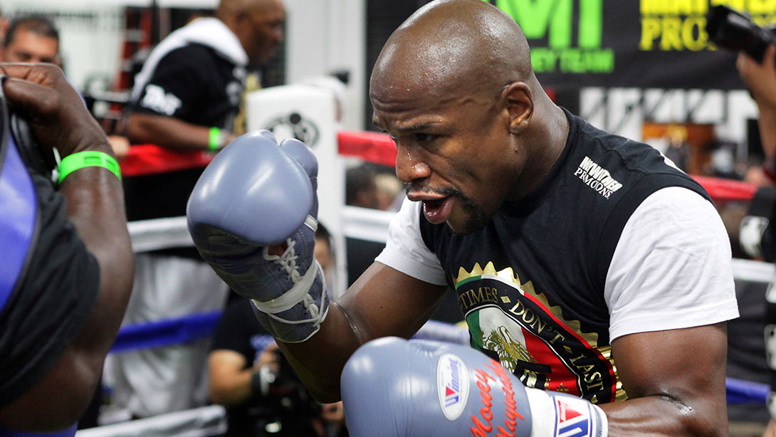 Floyd Mayweather Rocks Olympia Expo | Muscle & Fitness