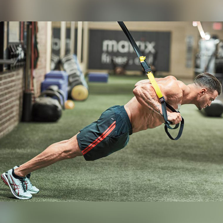 TRX Pushup Exercise Video Guide | Muscle & Fitness